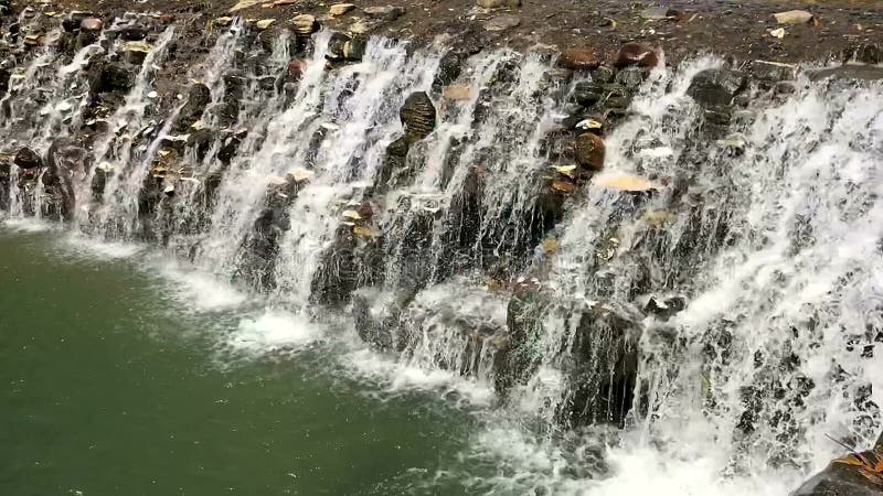 Waterfall on mountain stock footage. Video of season - 217347458