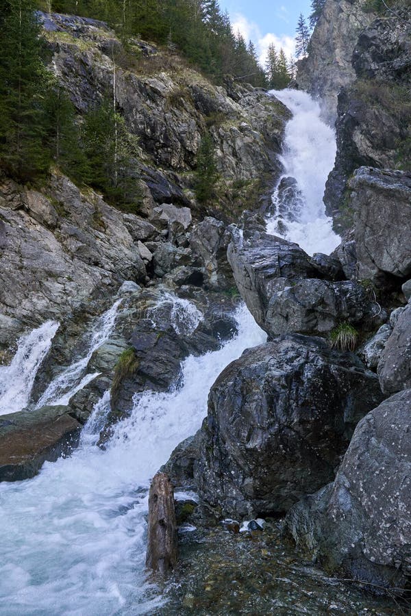 Waterfall in the mountains stock photo. Image of destination - 149197774