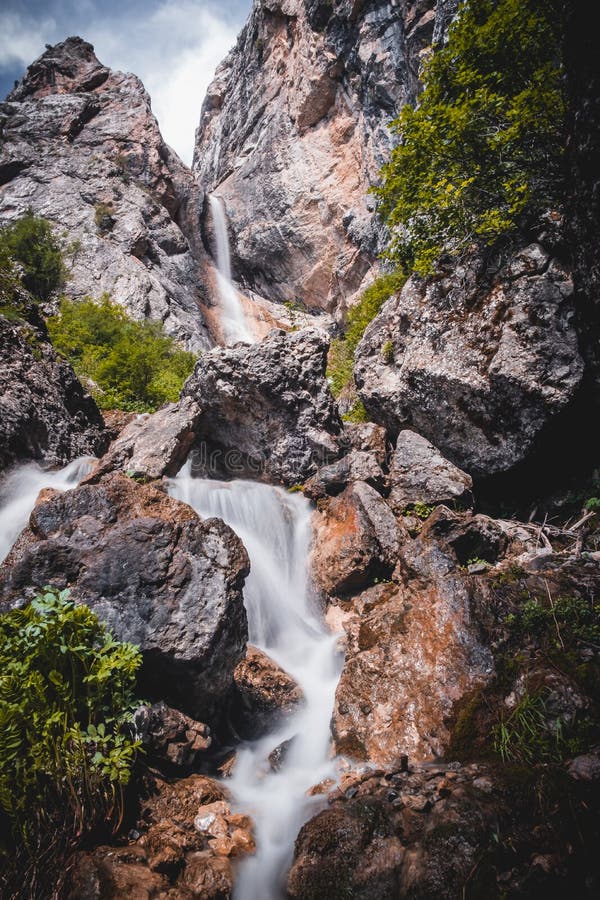 Waterfall in the Mountains in Spring with Refreshing Splashes Stock ...