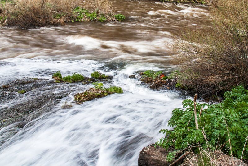 Waterfall in the mountains stock photo. Image of nature - 55674562