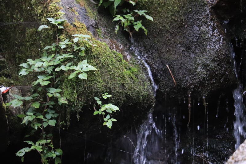Waterfall between Mountains Stock Image - Image of beautiful, clouds ...
