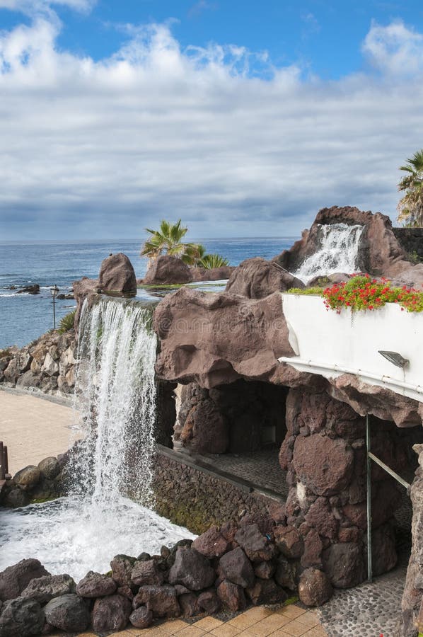 Waterfall next to the sea stock image. Image of stream - 43912847