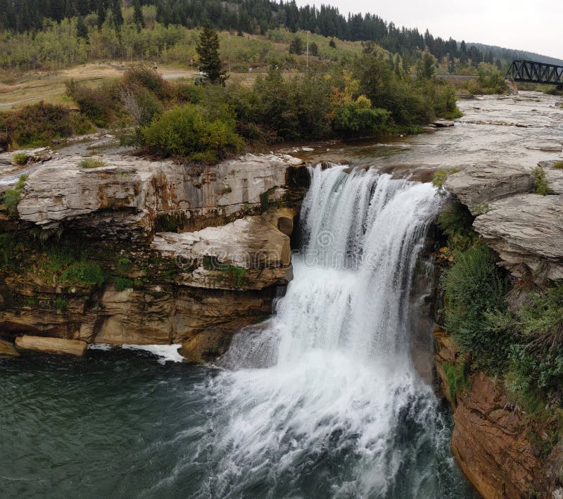 Waterfall - Old Train Bridge in Background Stock Image - Image of ...