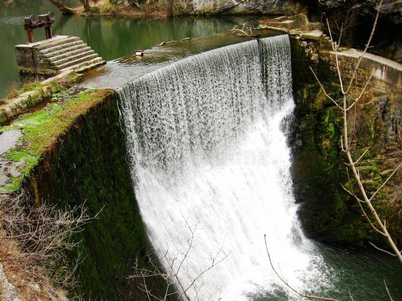 A waterfall over a dam stock image. Image of detail, jump - 41771337