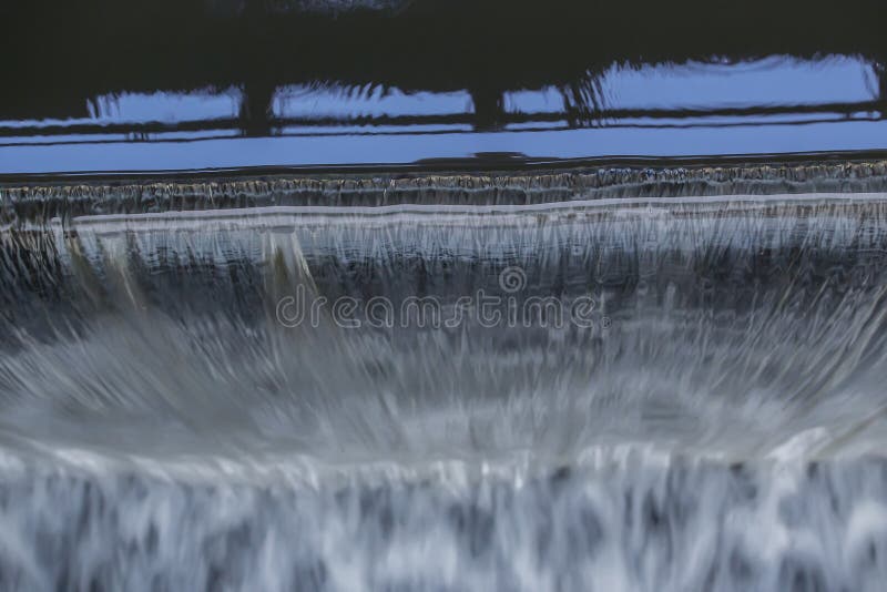 Waterfall Over the Edge of the Dam Stock Image - Image of cascade, flow ...