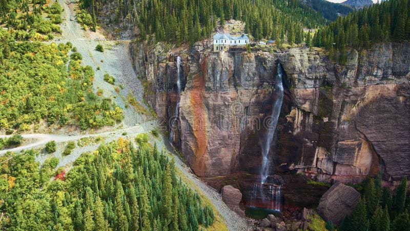 Waterfall Over Giant Cliff Face with Power Station at Top Stock Image ...