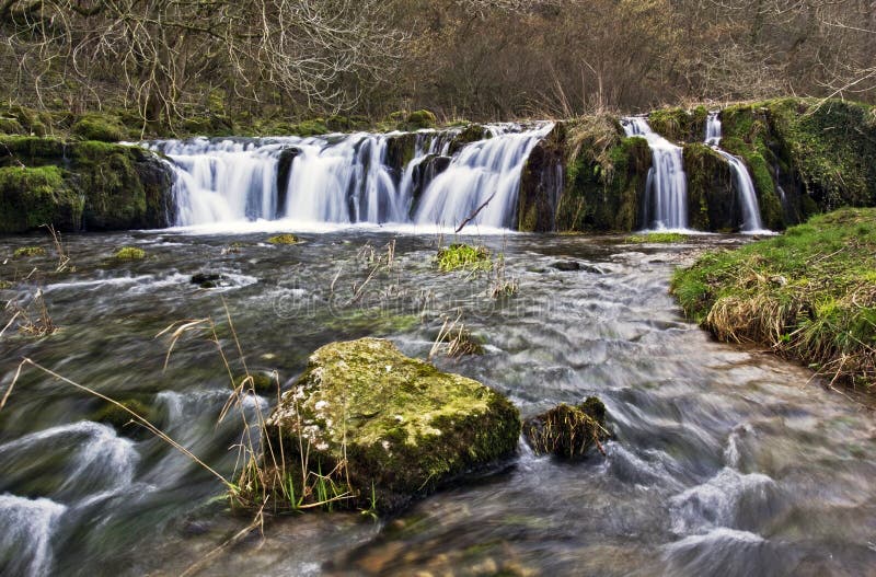 Waterfall over Mossy Rocks stock photo. Image of strewn - 38762736