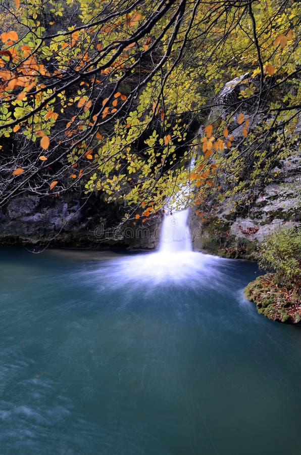 Waterfall and Pool in the River. Urederra River Natural Reserve Stock ...