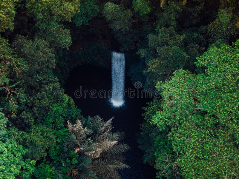 Waterfall in Rain Forest. Aerial Drone View of Tibumana Waterfall Stock ...