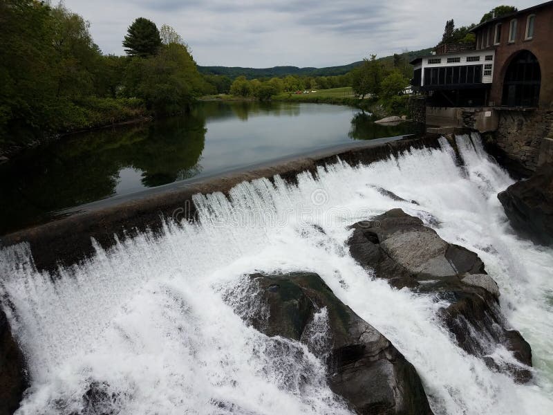 Waterfall or Rapids and Rocks and Building Stock Photo - Image of rocks ...