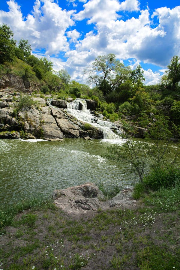 The Waterfall on the River Flows through and Over the Rocks Cove Stock ...