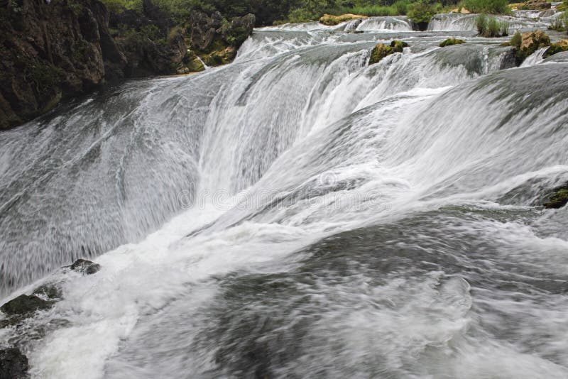 Waterfall on rock stock photo. Image of waterfall, blooming - 160014558