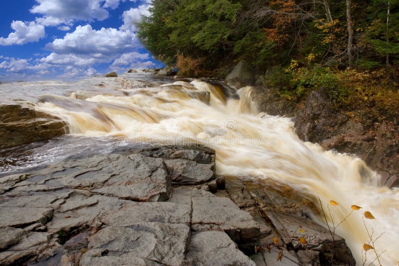 Wide Flat Waterfall Flowing into River Stock Image - Image of brook ...