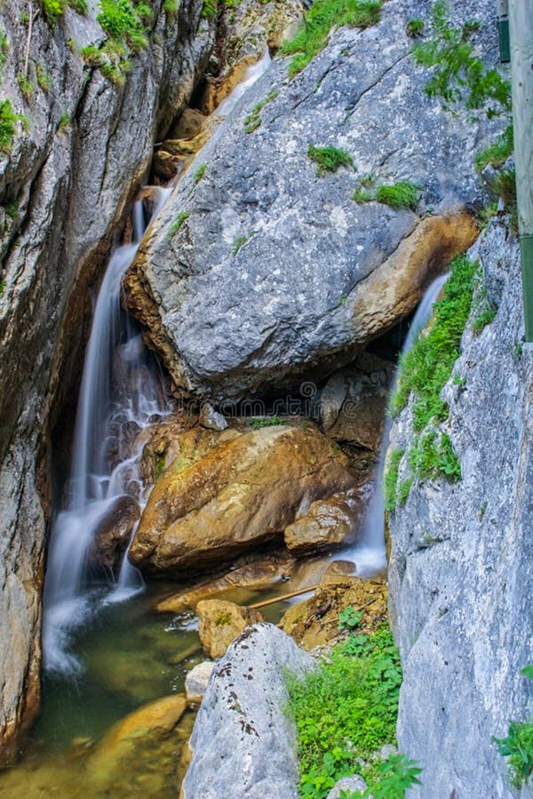 A Waterfall between the Rocks Stock Image - Image of america, blue ...