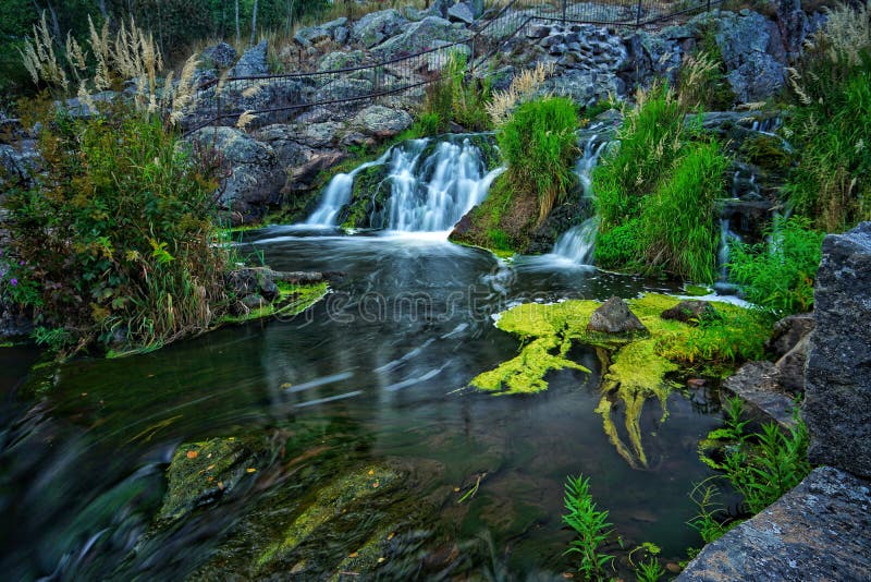 Waterfall between rocks stock image. Image of rapids - 158418645
