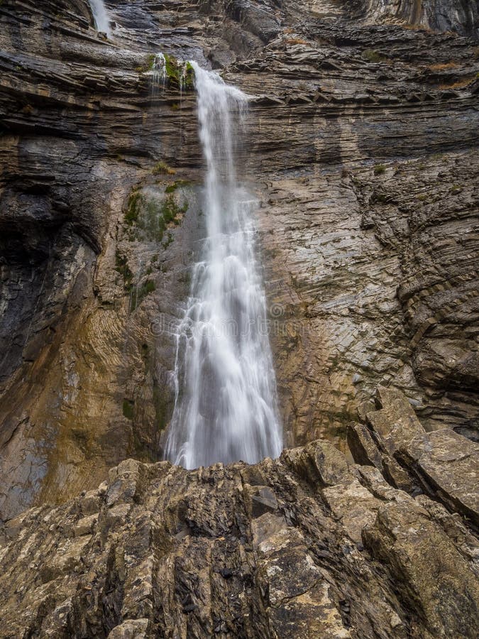 Waterfall in a Rugged Cliff Stock Image - Image of waterfall ...