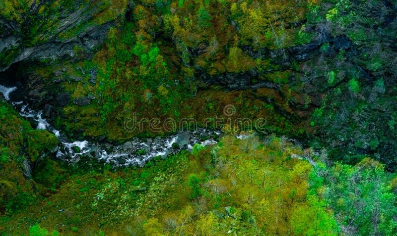 Waterfall in a deep ravine stock photo. Image of natural - 200537372