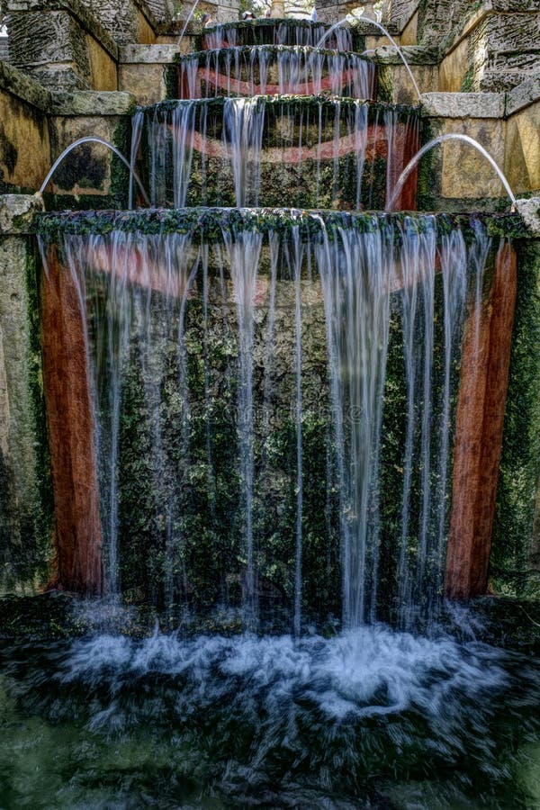 Waterfall in Rustic Old World Garden Landscaping Stock Image - Image of ...