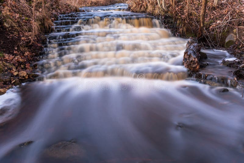 Waterfall in Several Stages and Fallen Leaves Stock Image - Image of ...