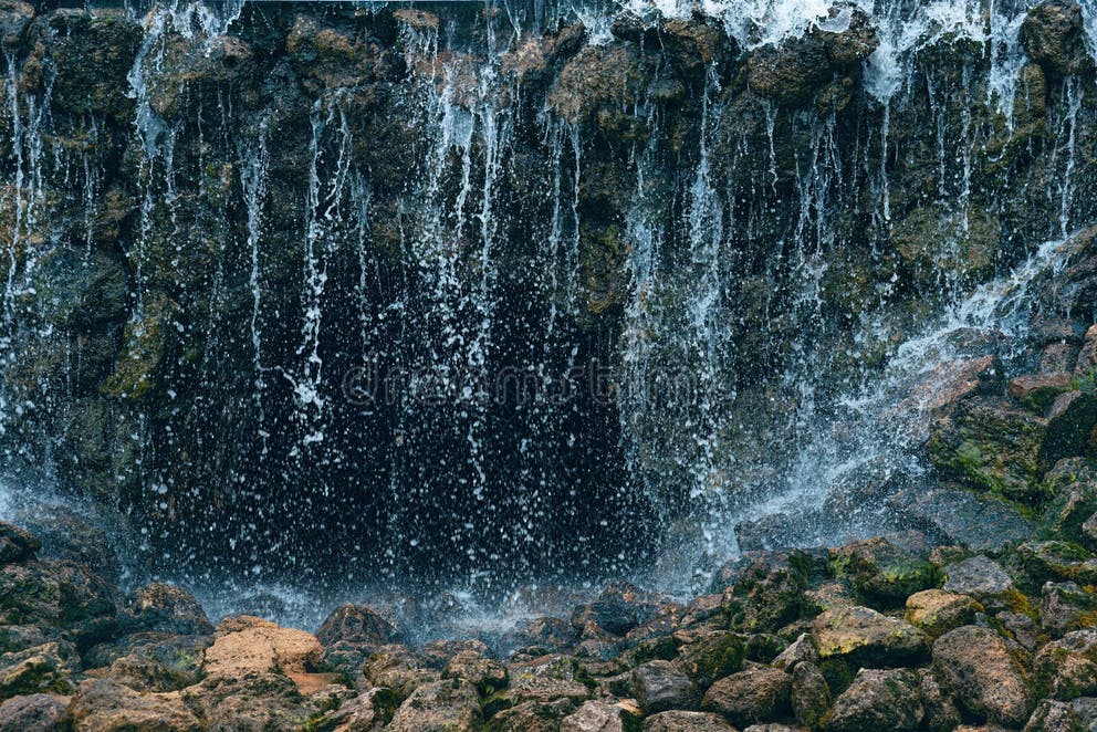 Waterfall with Splashes of Water with Wet Cobblestones Stock Photo ...