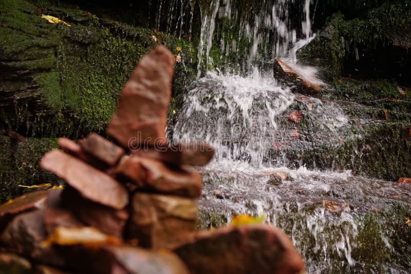 Waterfall with Stacked Rocks in Front of it, in the Woods Stock Photo ...