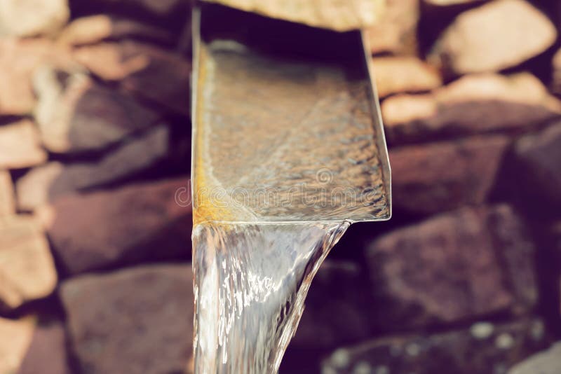 A Stream of Hot Metal, Molten Steel Flowing Along a Guide Chute. Stock ...