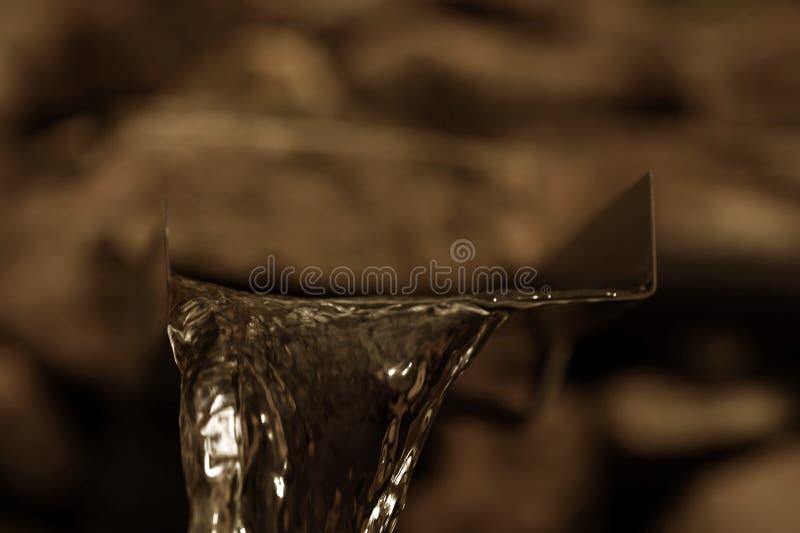 A Stream of Hot Metal, Molten Steel Flowing Along a Guide Chute. Stock ...