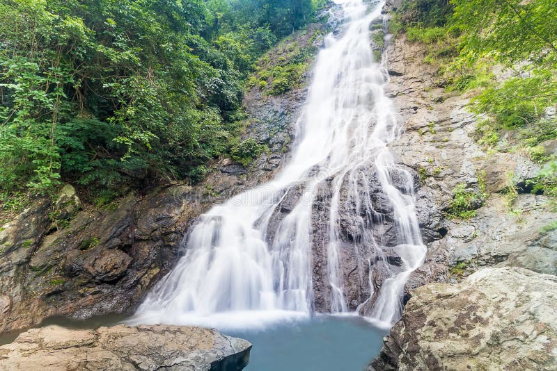 Waterfall Streams Falling from Mountain Top Covered with Green Forests ...