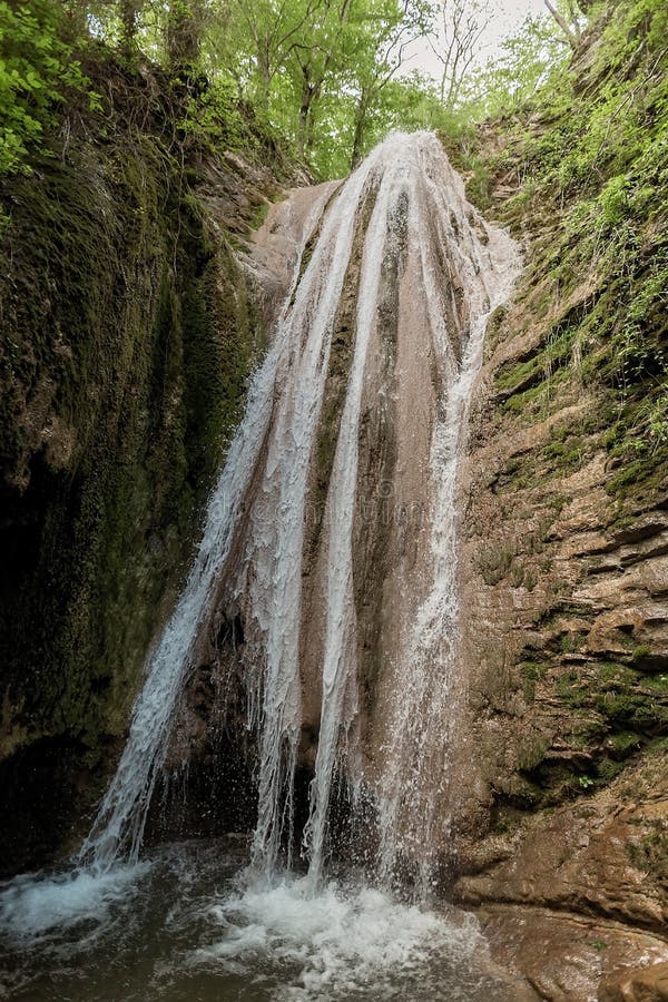 Waterfall. Streams of Water Fall Down on the Rocks. Stock Image - Image ...