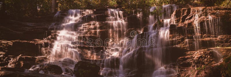 Waterfall on sunny day stock photo. Image of scenic - 135798734