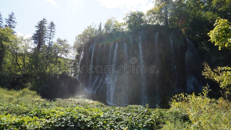 A Waterfall in the Sunshine Stock Image - Image of nature, green: 175831215