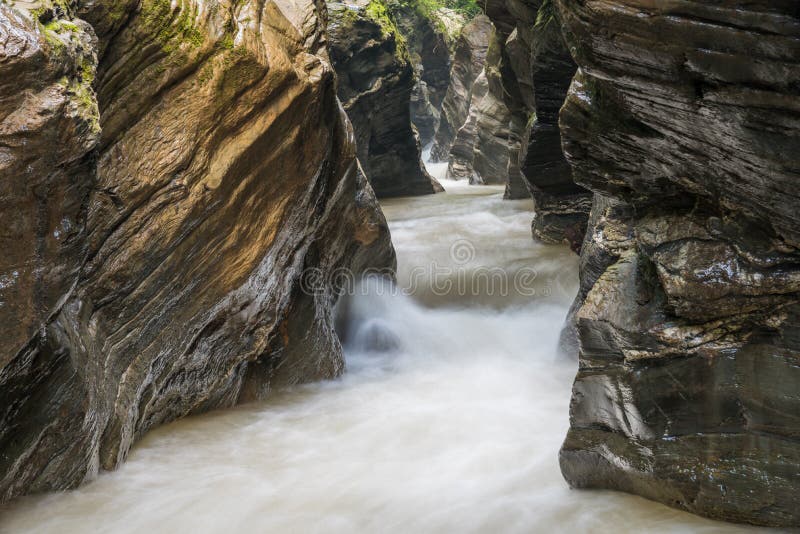 Waterfall Surrounded by Rocks Stock Image - Image of park, stone: 128952437