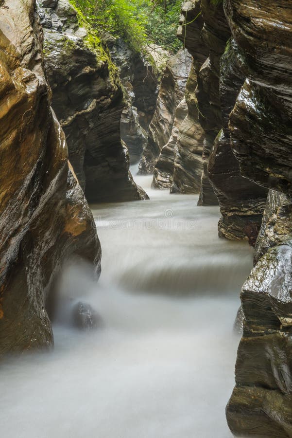Waterfall Surrounded by Rocks Stock Photo - Image of stone, environment ...