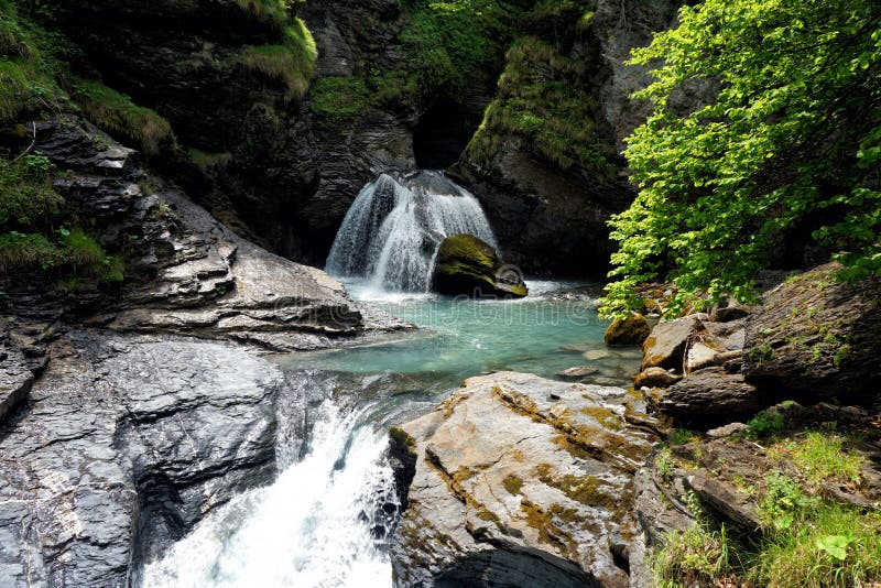 Waterfall in Switzerland stock image. Image of forest - 63022869