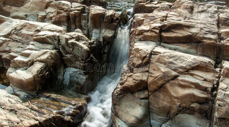 Waterfall between Two Eroding Stone Wall Stock Photo - Image of wall ...