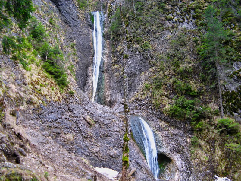 A Waterfall on Two Levels Surrounded by Forest Stock Photo - Image of ...