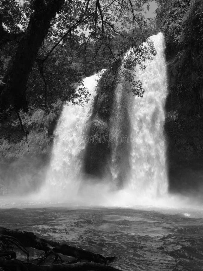 A Waterfall with Two Waterfalls in the Foreground and One in the ...
