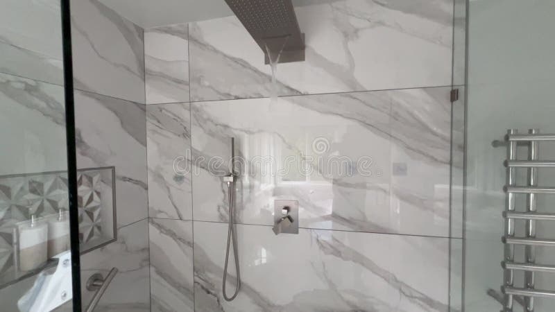 Waterfall Type Shower Faucet Running in Large Master Bathroom Shower ...