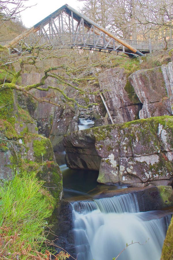Waterfall Under Footpath Walking Bridge Running through the Woods Stock ...