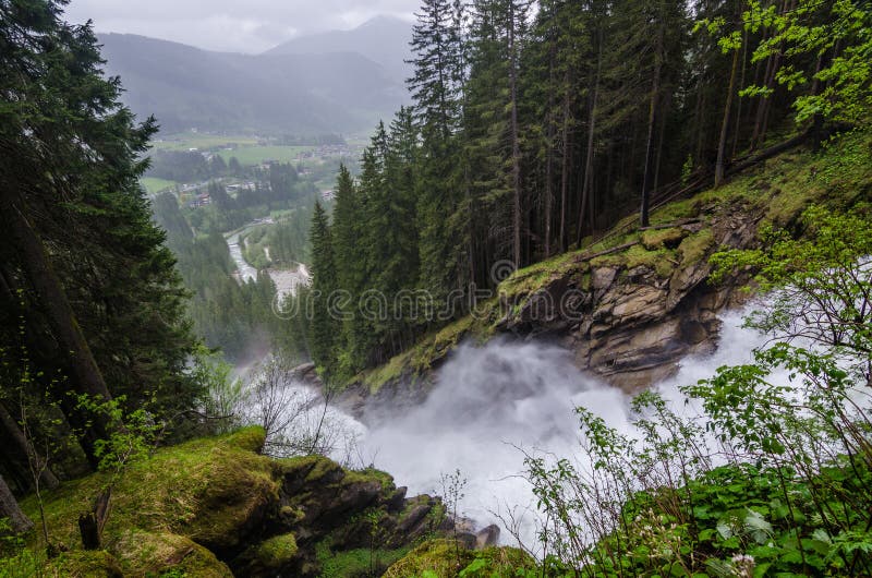 Waterfall into the valley stock photo. Image of naturally - 83240554