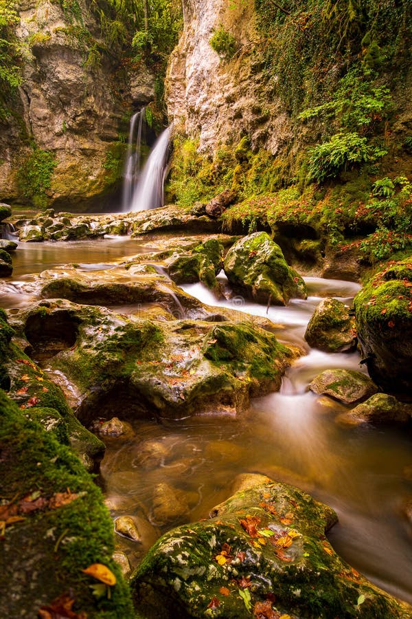 A Waterfall with Water Running between Rocks Stock Photo - Image of ...