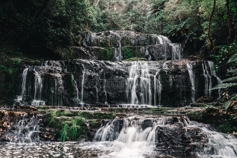 Waterfall Water Rushing Down into the Lake among the Moss and Grass by ...