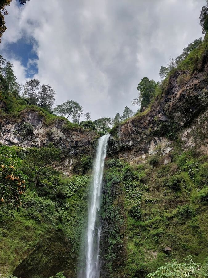 Waterfalls and high cliffs stock image. Image of journey - 356590809