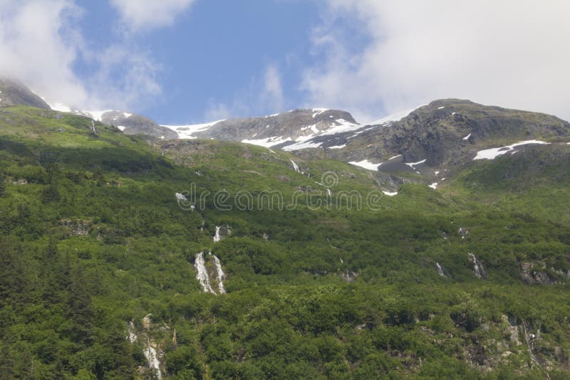 Waterfalls and Mountainside Greenery in Alaska Stock Image - Image of ...