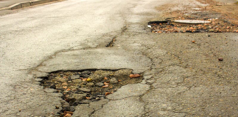 Pothole on Countryside Road Stock Image - Image of rocks, textures ...