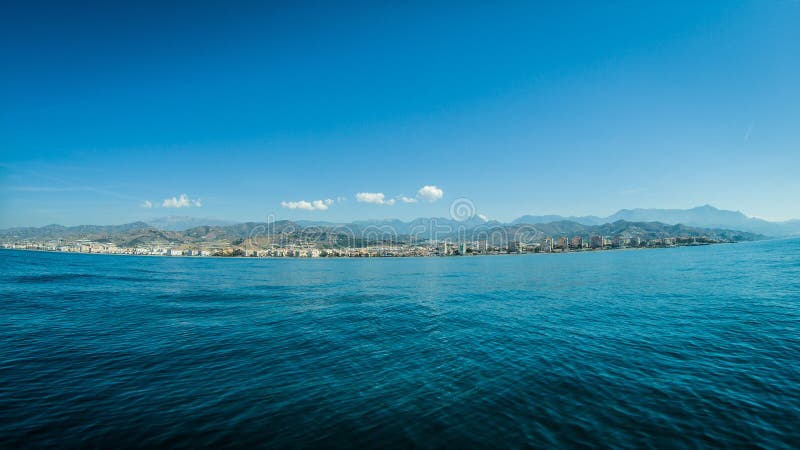 Waterfront Cityscape Against Mountain Range Background Stock Photos ...