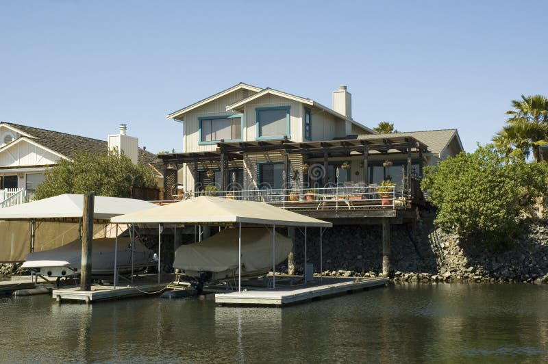Waterfront home and dock stock image. Image of driveway - 2209403