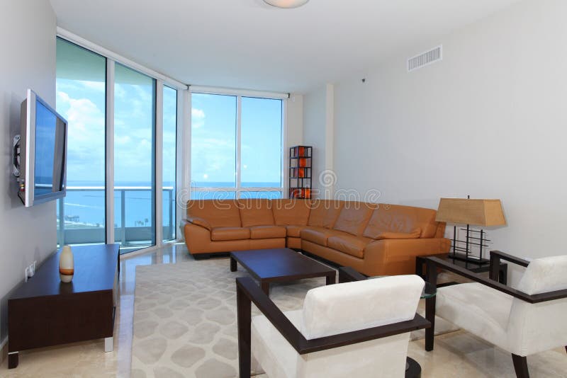 Waterfront Livingroom stock image. Image of chairs, home - 14450545