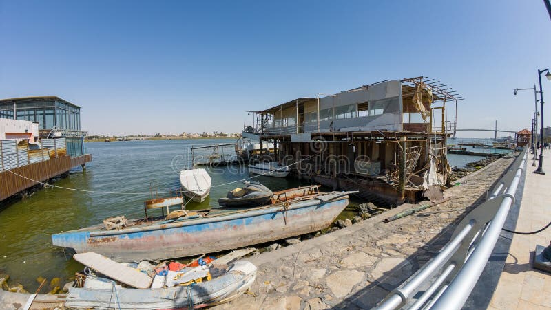 Waterfront with Old Boats and Dilapidated Building Stock Photo - Image ...