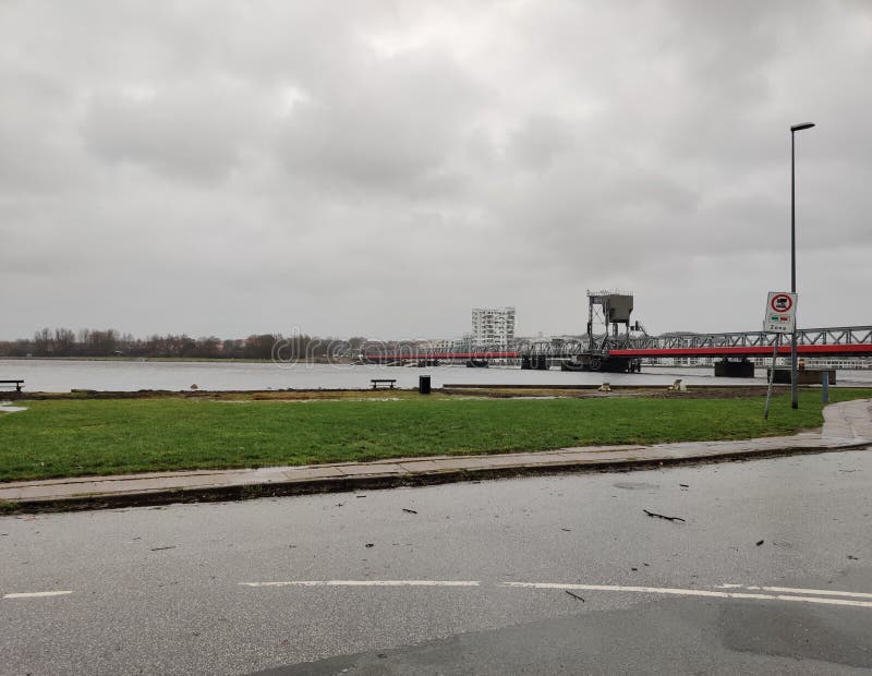 Waterfront with Road and Bridge in Background Stock Photo - Image of ...